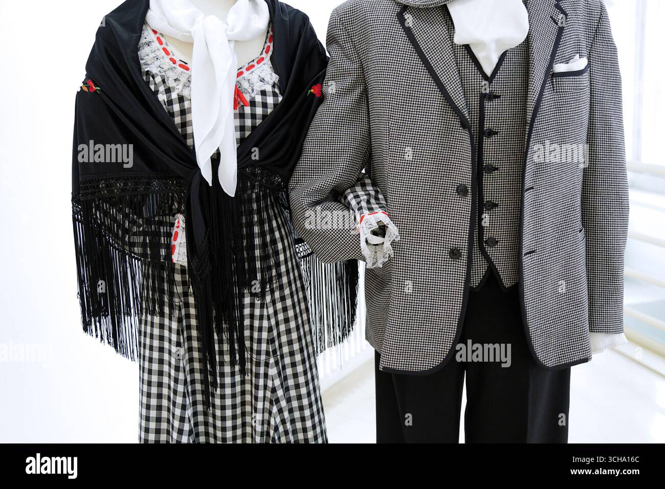 Traditional Madrid chulapo and chulapa costume with checkered patterns ...