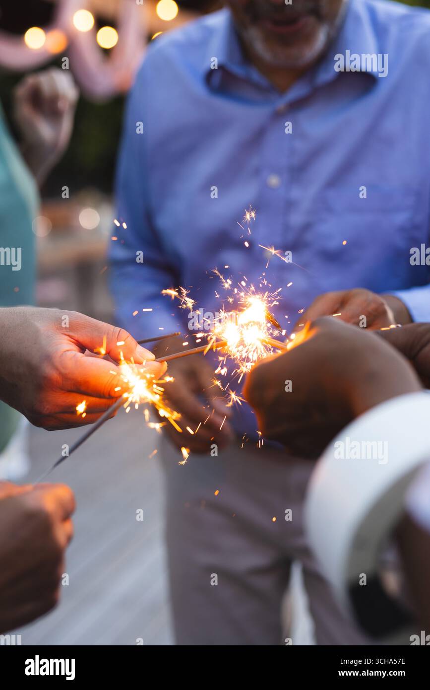Diverse family celebrating sparklers hi-res stock photography and ...