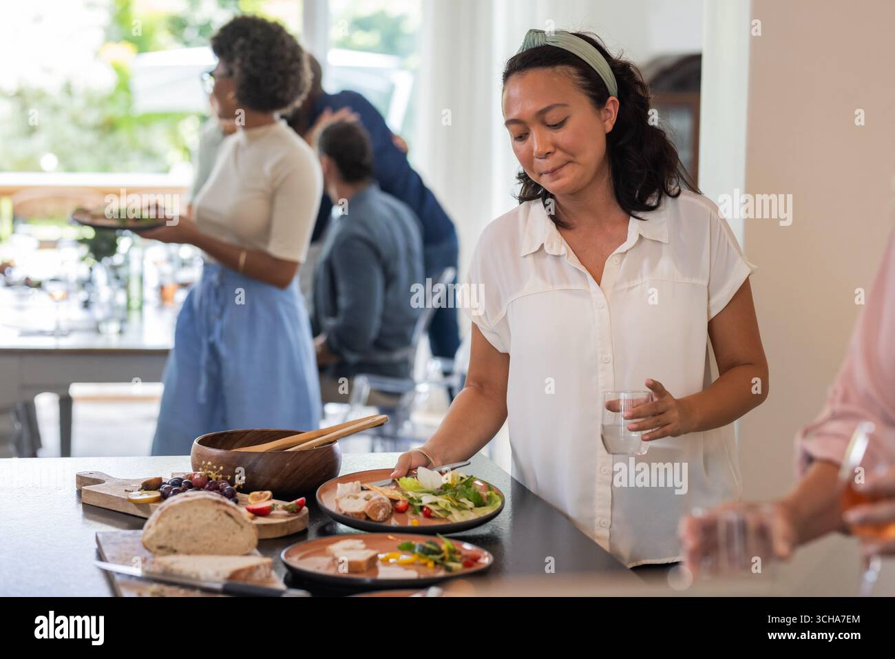 Guests enjoying buffet lunch hi-res stock photography and images - Alamy