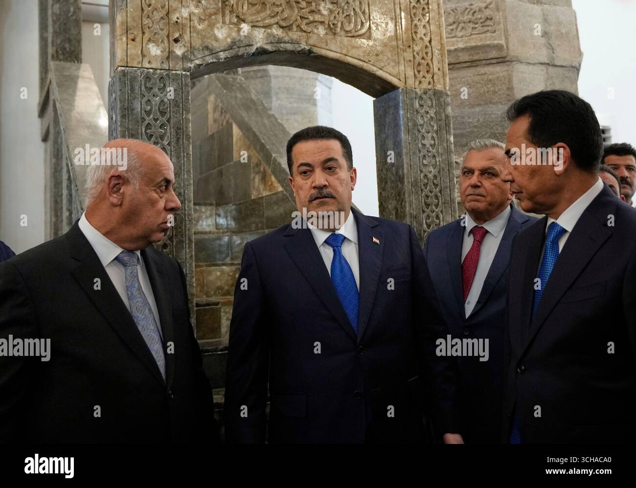 Iraqi Prime Minister Mohammed Shia al-Sudani, center, presides over the ...