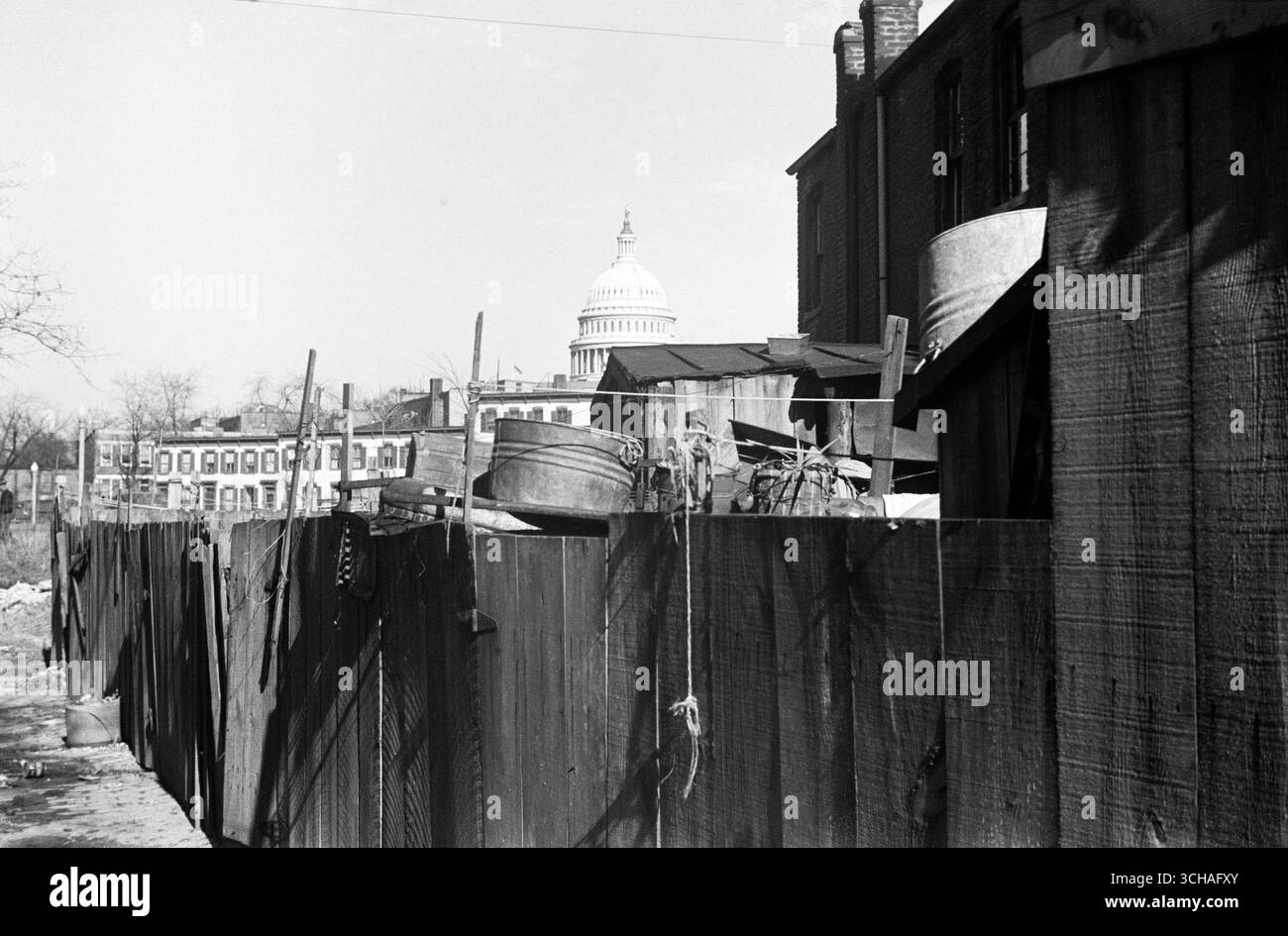 Washington, D. C. slums with Capitol Building in the background - John ...