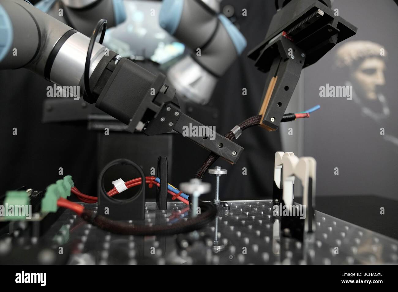 A robot performs cable routing at the first International Humanoid ...