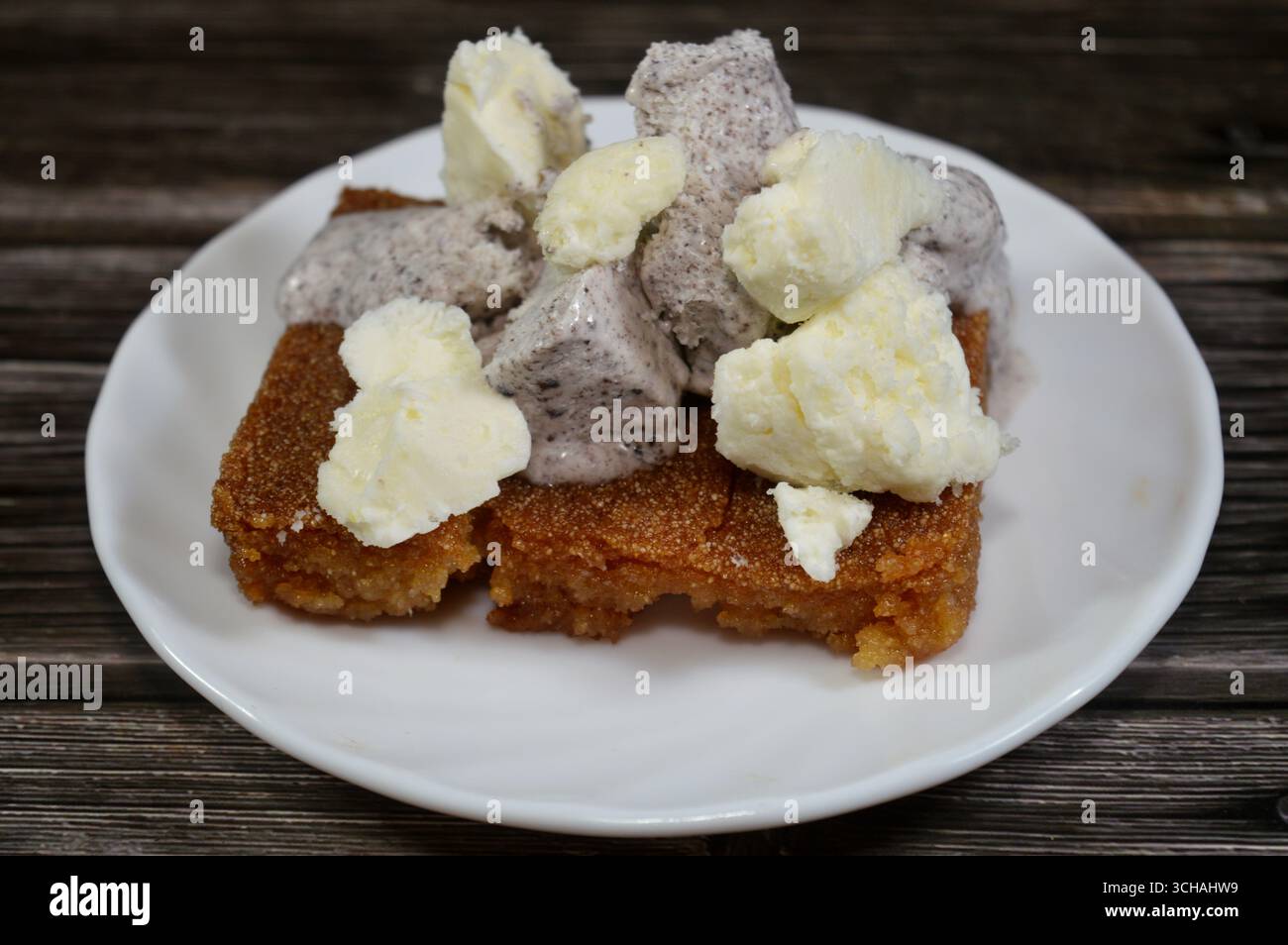 Basbosa Topped with ice cream with cookies, creamy qeshta dairy creamy ...