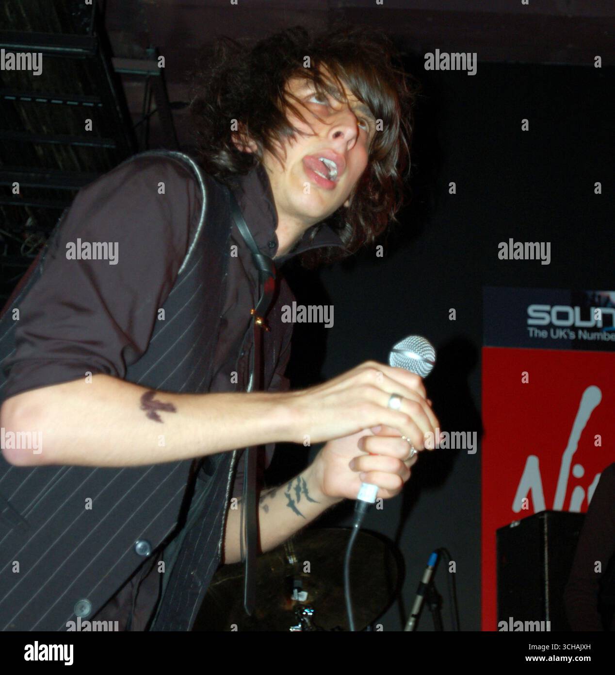 Faris Badwan of The Horrors performing live at the Virgin Megastore in ...
