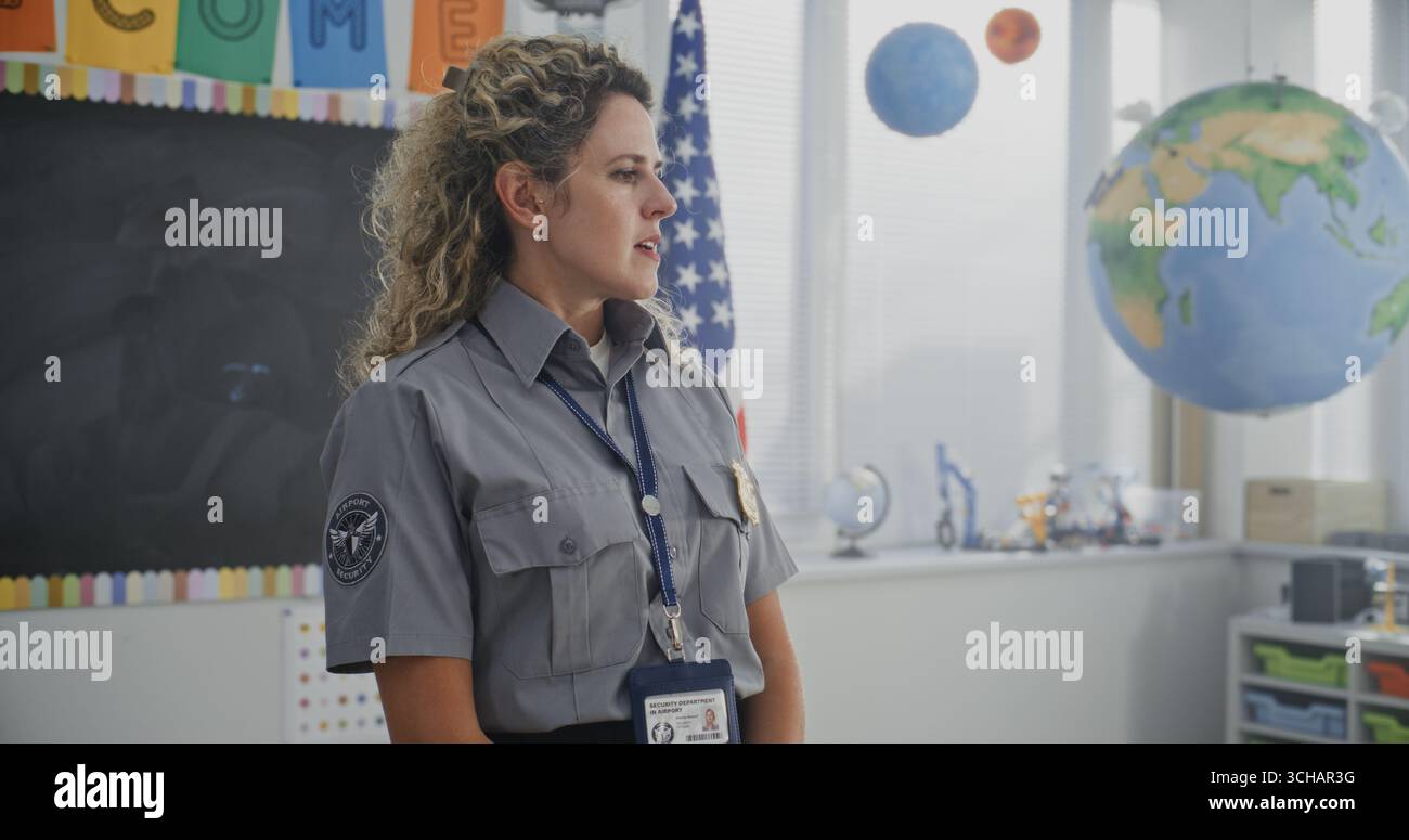 American Female TSA Security Officer in Uniform Giving Lecture ...