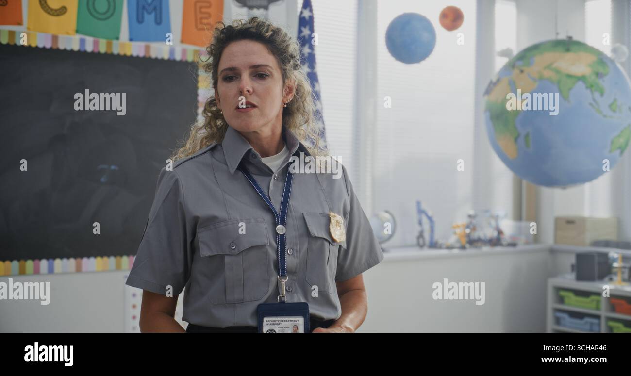 American Female TSA Security Officer in Uniform Giving Lecture ...