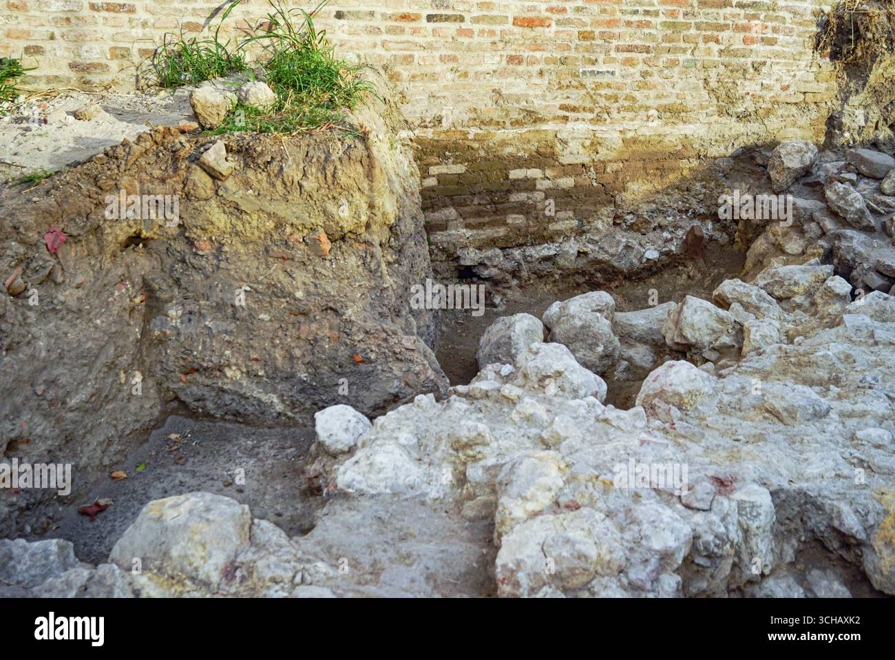Archaeological excavation site revealing stone foundations and walls ...