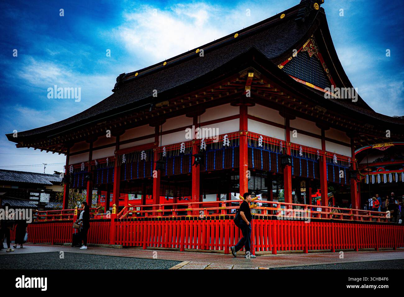 Vibrant red Shinto shrine building with traditional architecture under ...