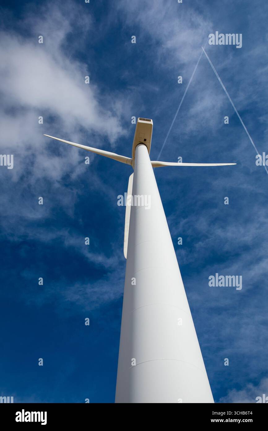 Marvel at the impressive height of wind turbines stretching towards the ...