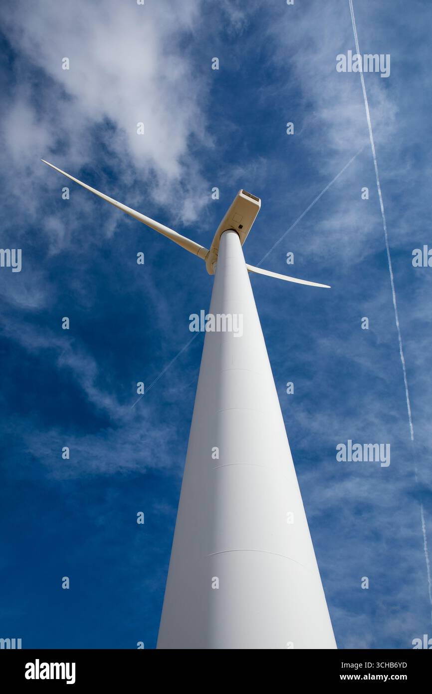 Marvel at the impressive height of wind turbines stretching towards the ...
