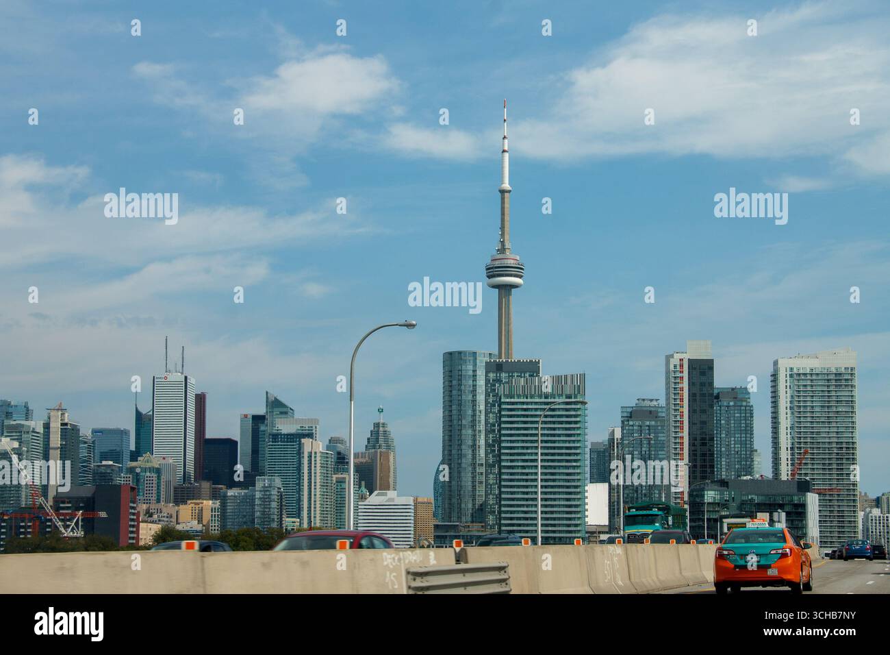 The Toronto skyline skyscrapers and CN tower from the highway, Ontario ...