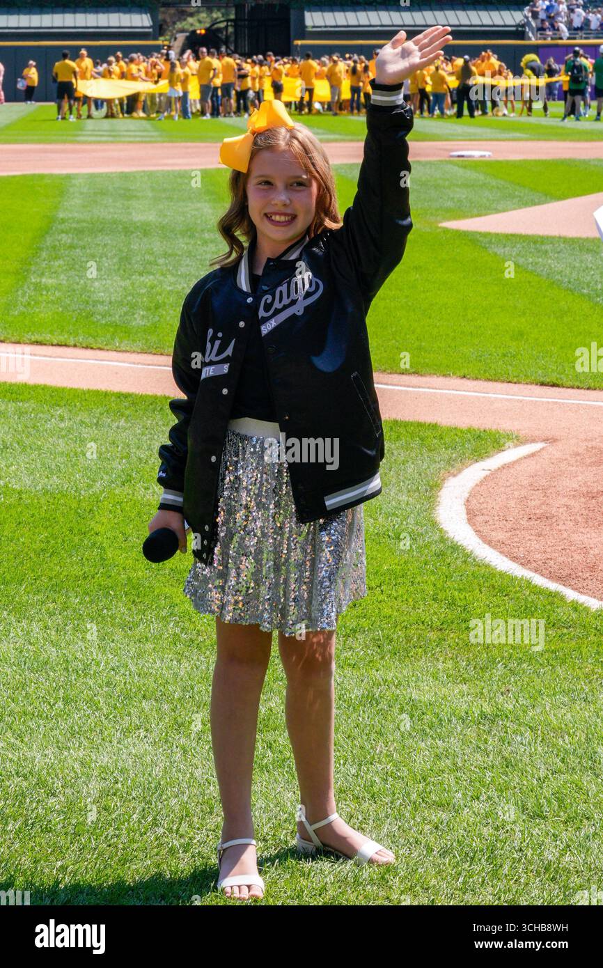 National Anthem performer 10-year-old Sophia Hope waves after singing ...