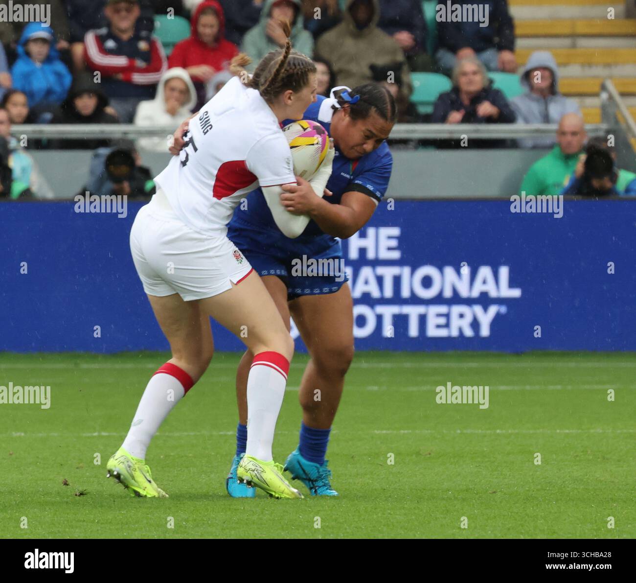 England's(Red Roses)Emma Sing(Gloucester–Hartpury) gets tackled by ...