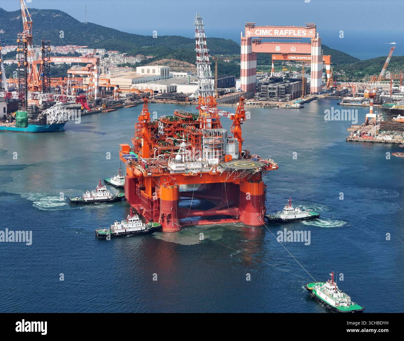 Tugboats push Scarabeo 5, a floating production unit (FPU) converted ...