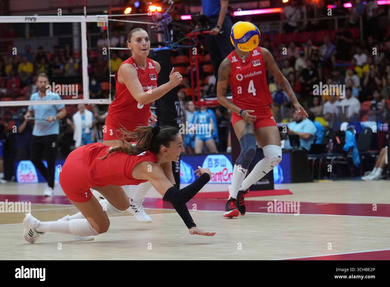 Turkey's Hande Baladin, left, receives the ball from Slovenia's the ...