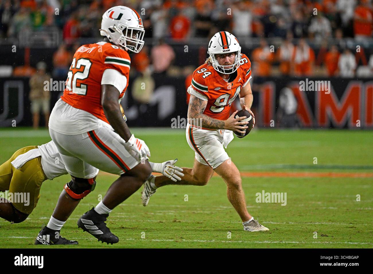 MIAMI GARDENS, FL - AUGUST 31: Miami punter Dylan Joyce (94) scrambles ...