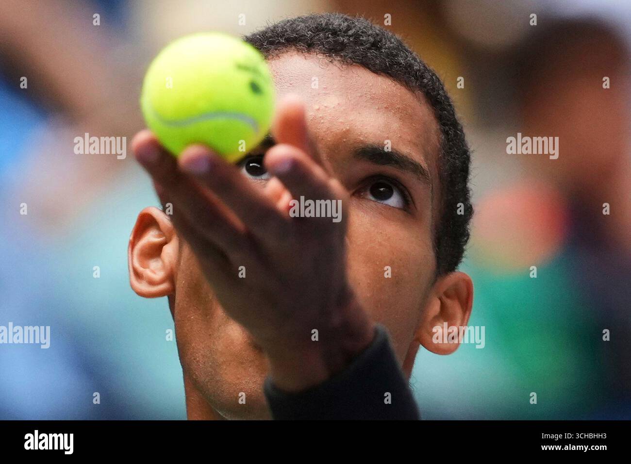 Felix Auger-Aliassime, of Canada, serves against Andrey Rublev, of Russia, during the fourth ...
