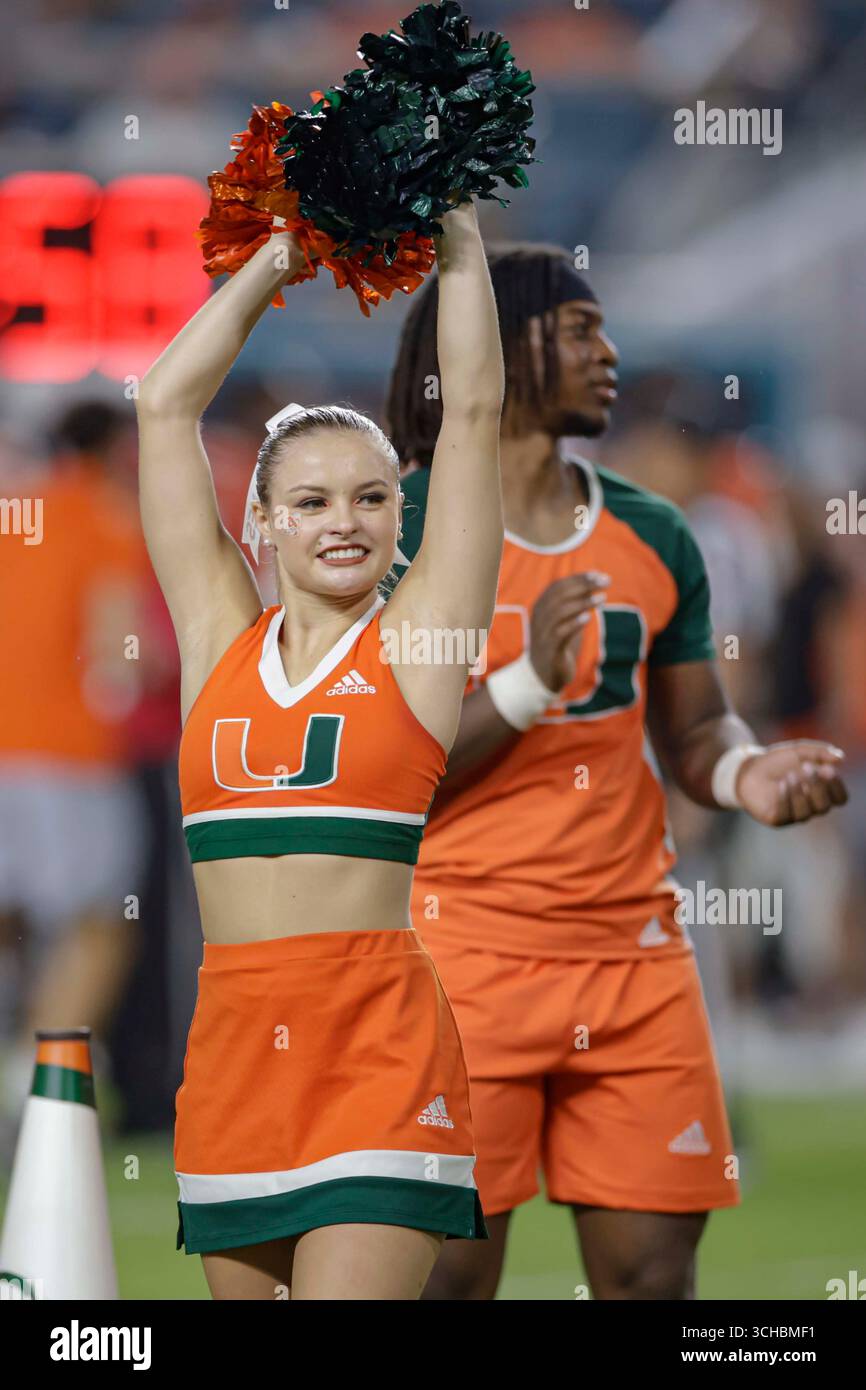 Miami, FL: One of the Miami Hurricanes cheerleaders entertains the fans ...