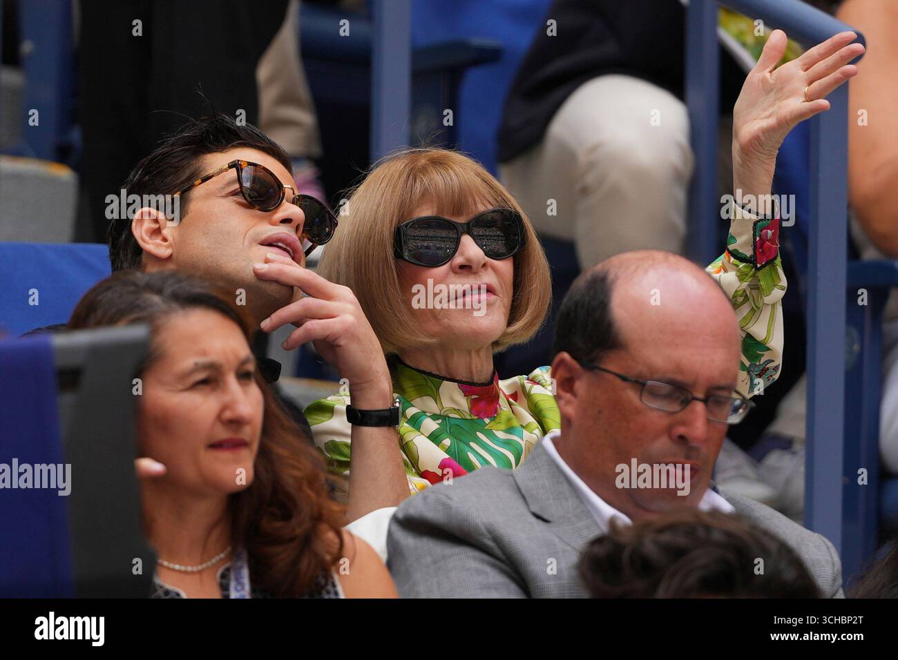 Rami Malek, left, and Anna Wintour watch a match between Felix Auger ...
