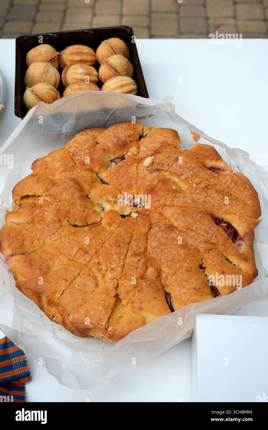 Rich pastry delights and a golden cake await guests on a warm afternoon ...