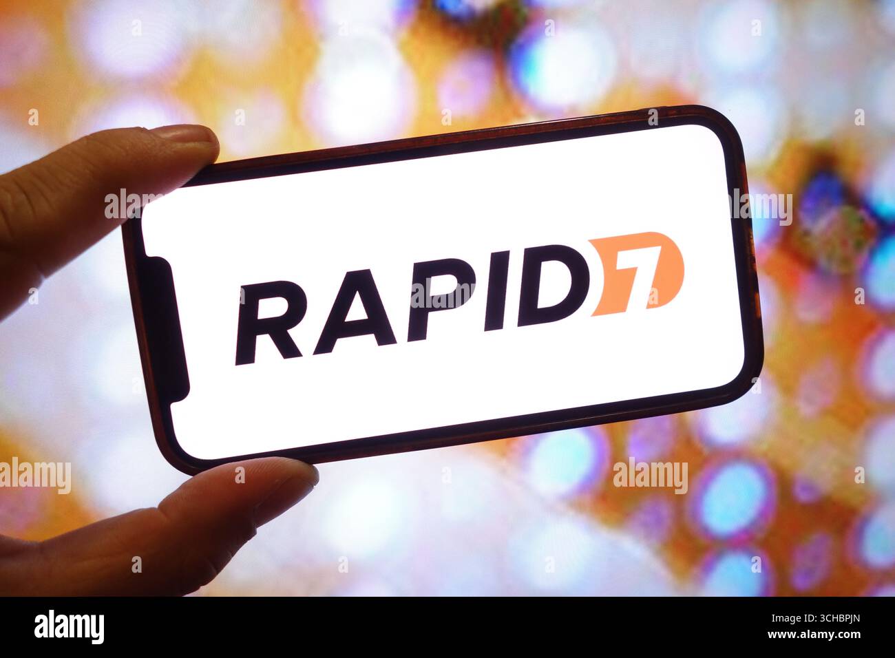 In this photo illustration, a Rapid7 company logo is seen displayed on ...