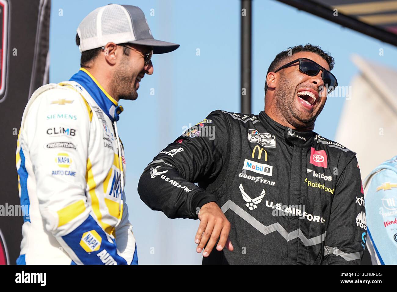Bubba Wallace, right, and Chase Elliott joke prior to a NASCAR Cup ...