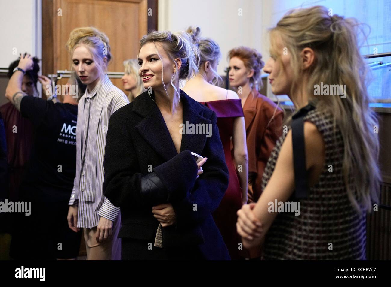 Models are prepared for a runway show by Russian brand Soroka On Course ...