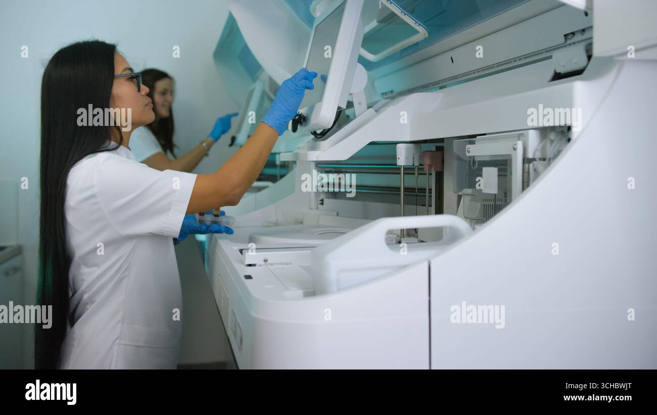 Medical team conducting observation testing hi-res stock photography ...