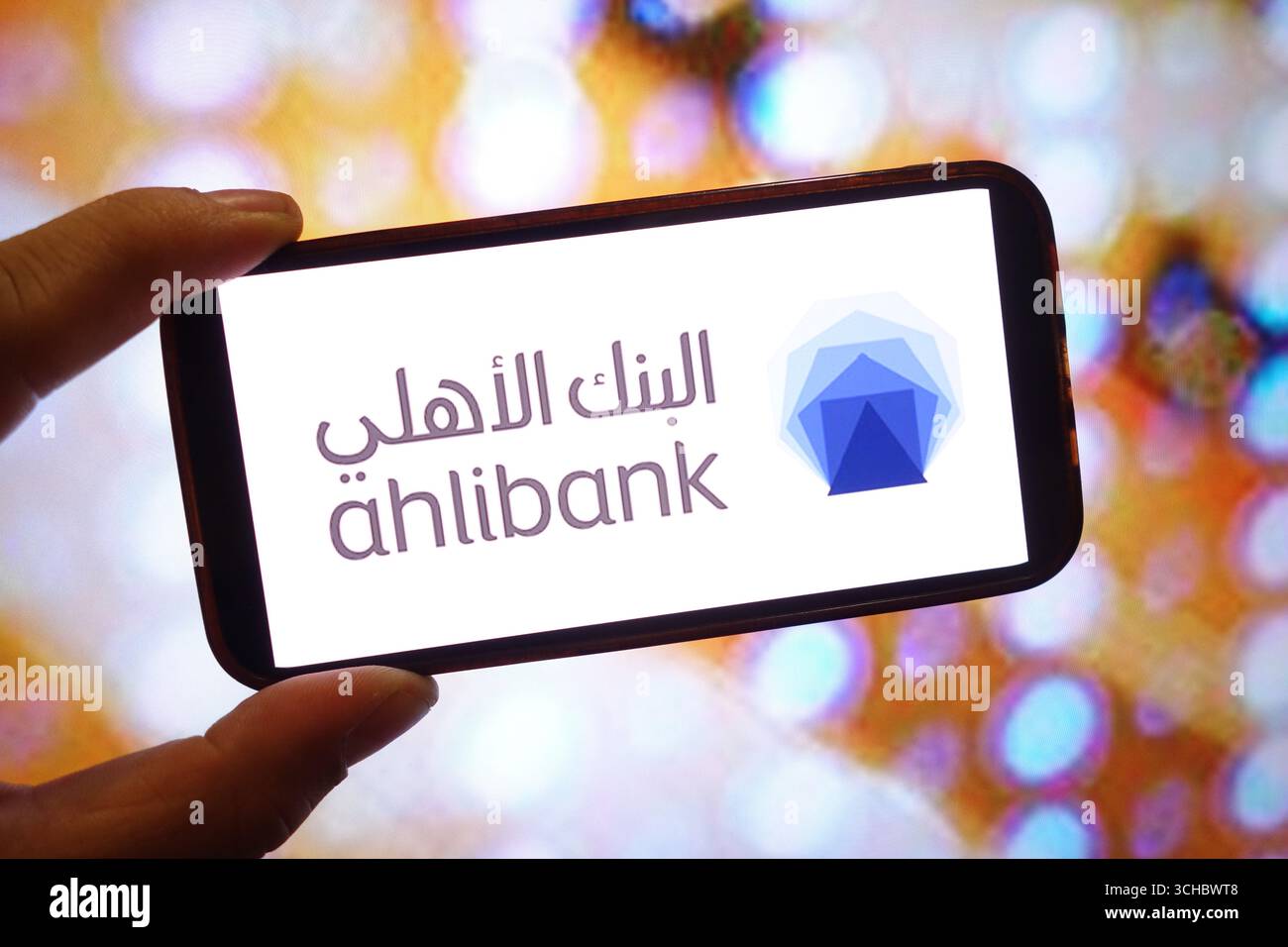 In this photo illustration, a Ahli Bank company logo is seen displayed ...