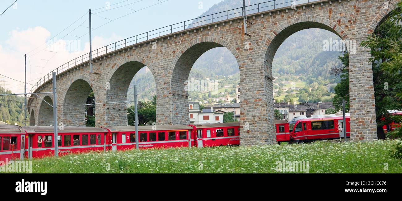 The Bernina Express approaching the Brusio spiral viaduct Stock Photo ...