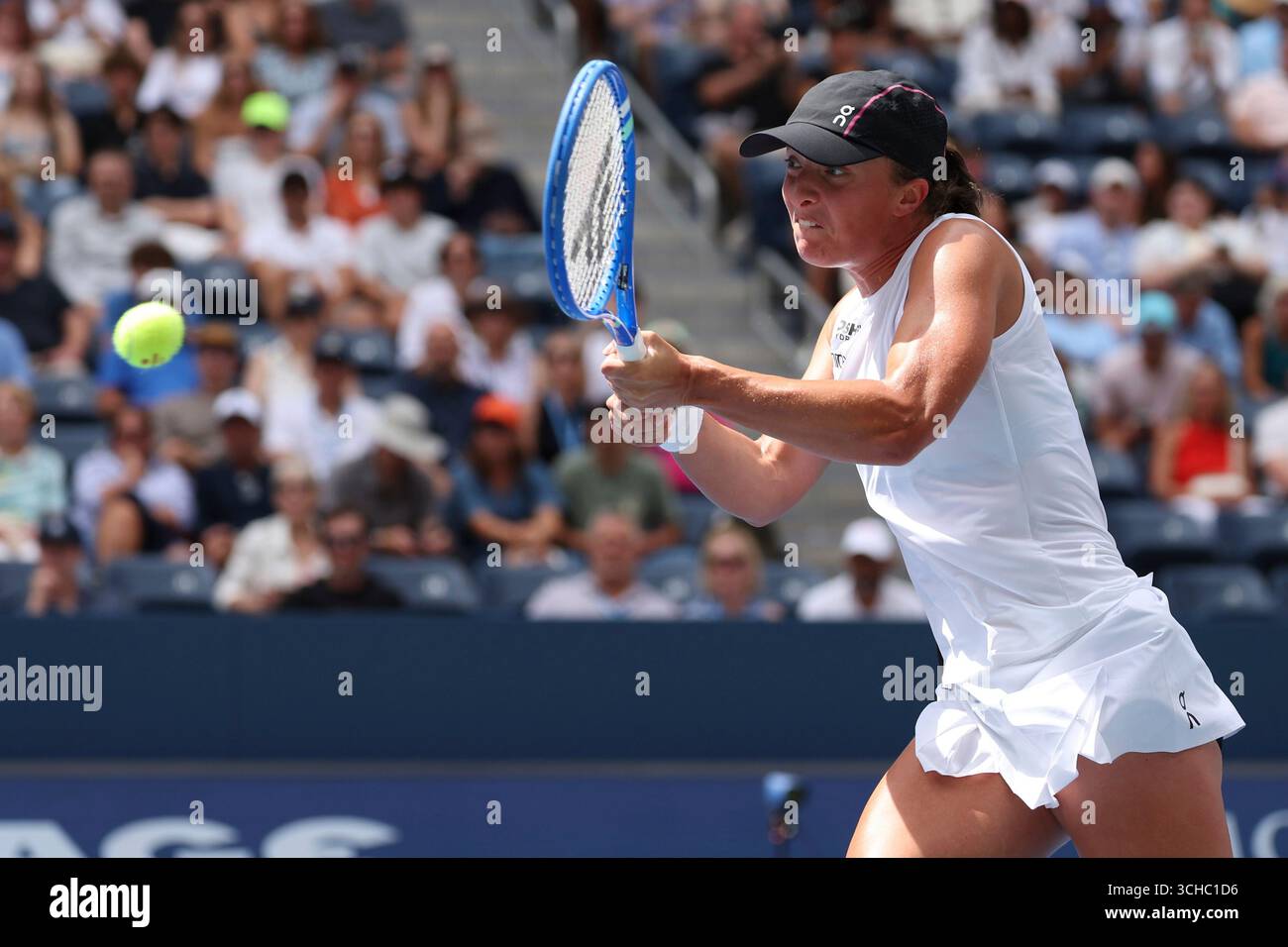 Iga Swiatek, of Poland, returns a shot against Ekaterina Alexandrova, of Russia, during the ...