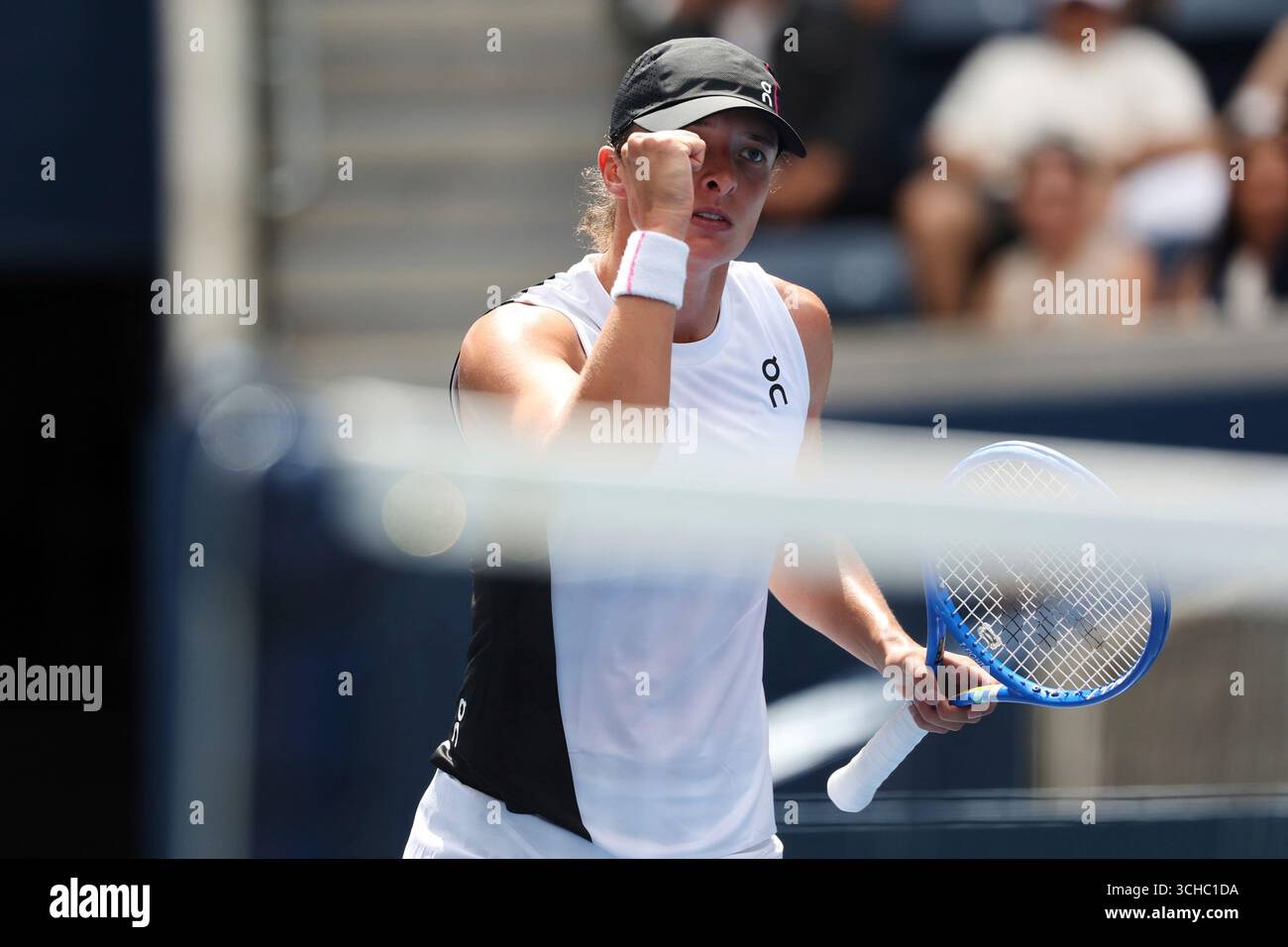 Iga Swiatek, of Poland, reacts during a match against Ekaterina Alexandrova, of Russia, in the ...