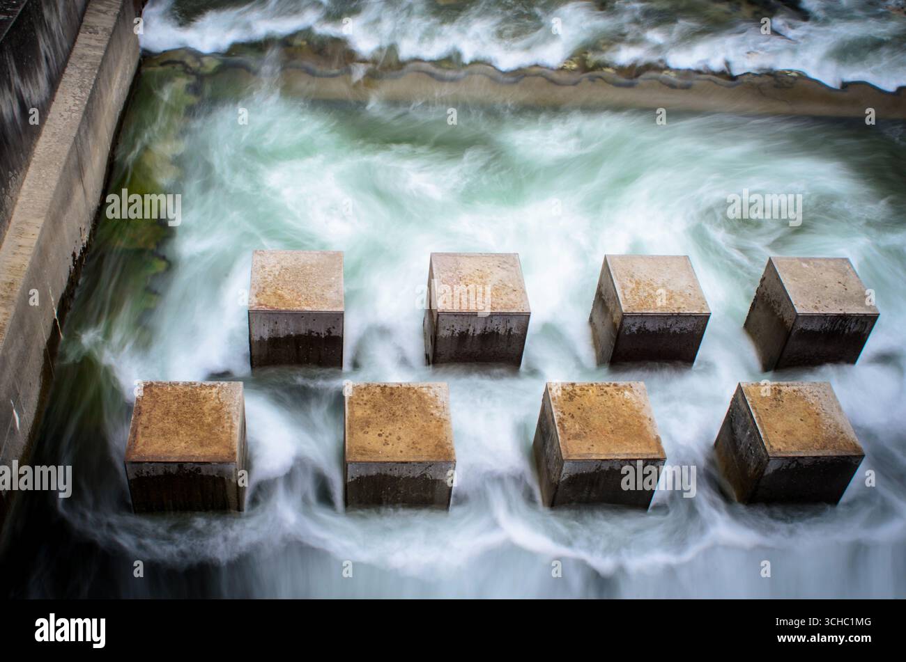Cubic barriers in turbulent water creating ripples and natural flow ...