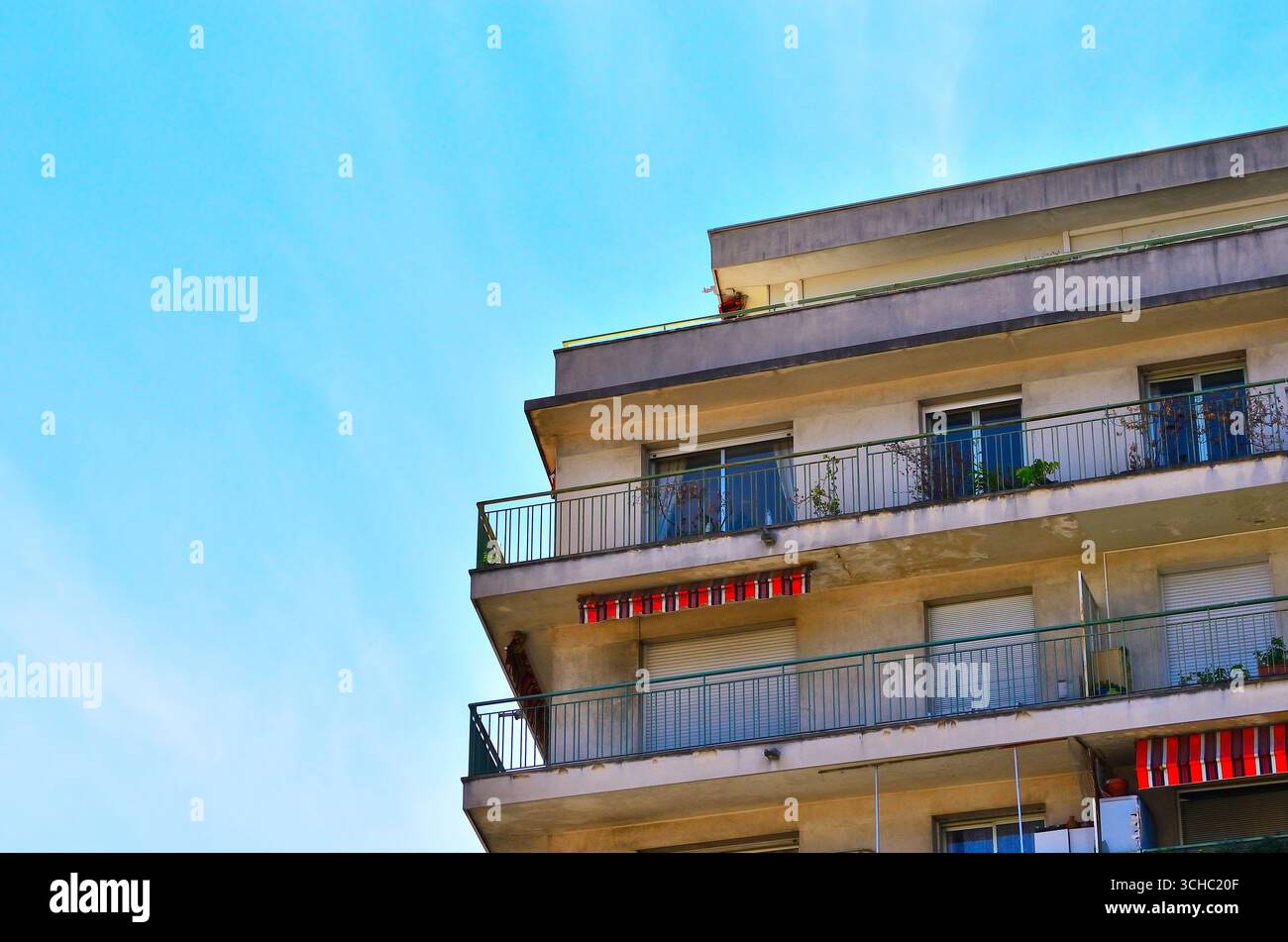 Balconies on upper floors of modern residential building in France ...