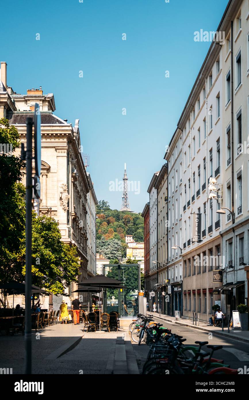 Street view in central Lyon with outdoor cafes bicycles classic French ...
