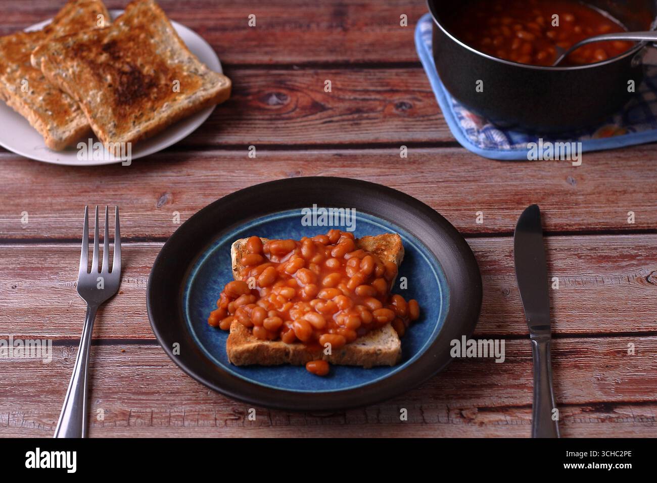 Baked Beans on toasted multigrain bread Stock Photo - Alamy