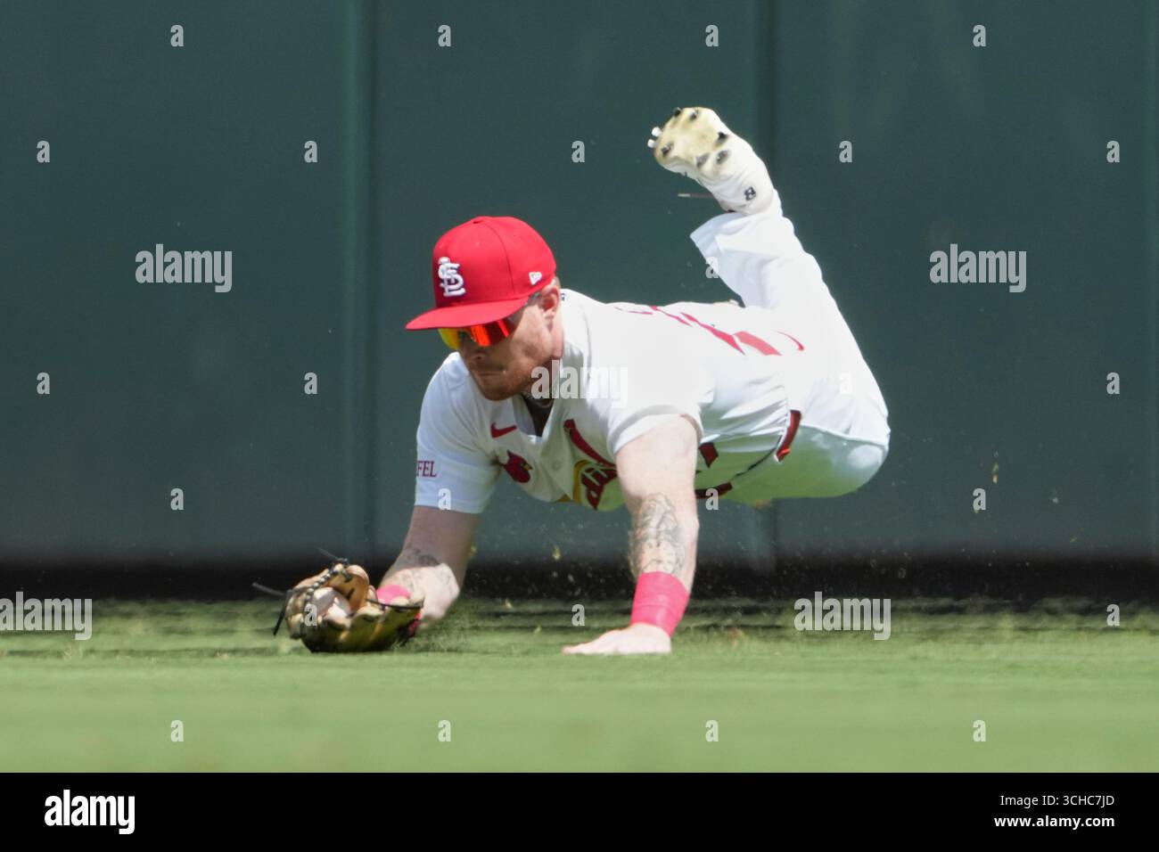 St. Louis Cardinals center fielder Nathan Church dives and catches a ...