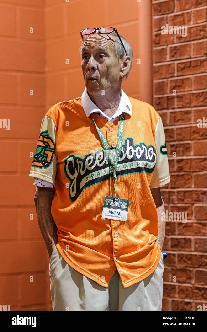 Greensboro, NC: Usher Phil talks with fans in the eighth inning during ...