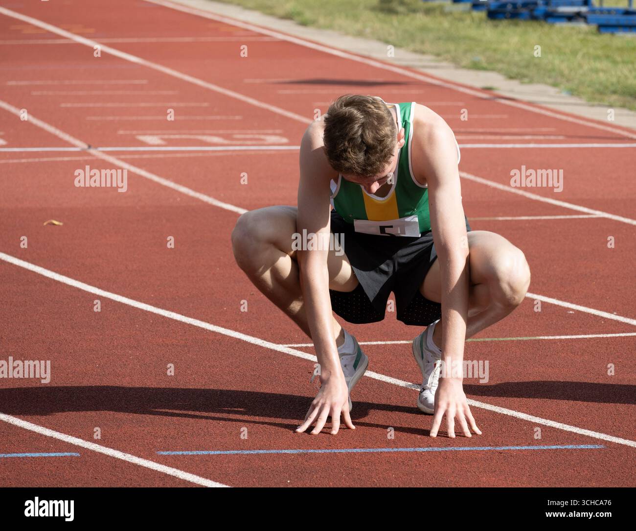 Inter-club athletics, exhausted runner at end of men`s 1500m race ...