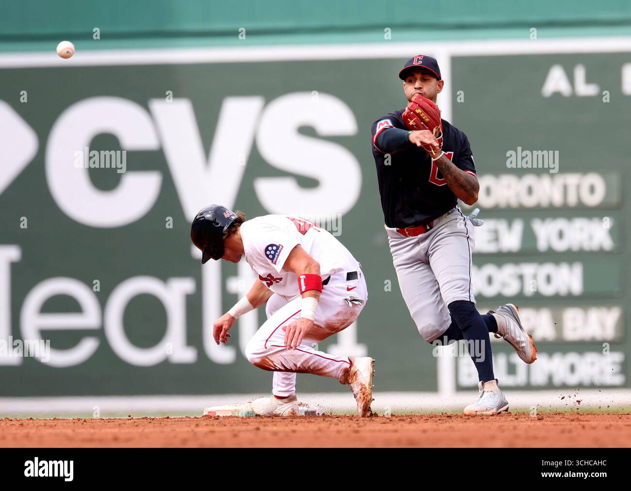 Cleveland Guardians shortstop Brayan Rocchio, right, makes the tag on ...
