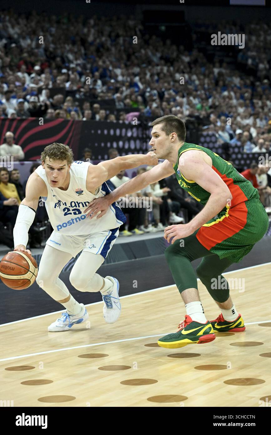 Finland's Lauri Markkanen (L) and Lithuania's Azuolas Tubelis during the basketball FIBA ...