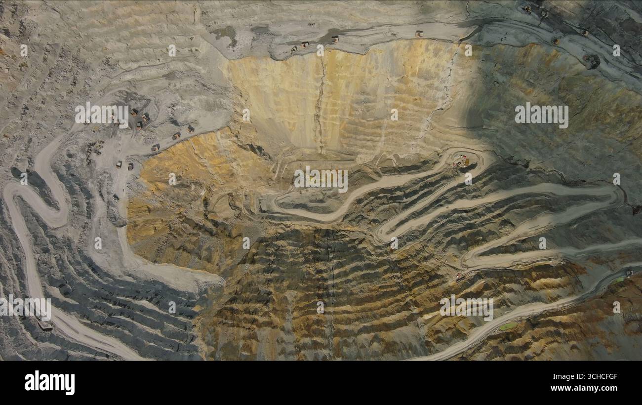 Aerial of open mine and heavy mining equipment Stock Photo - Alamy