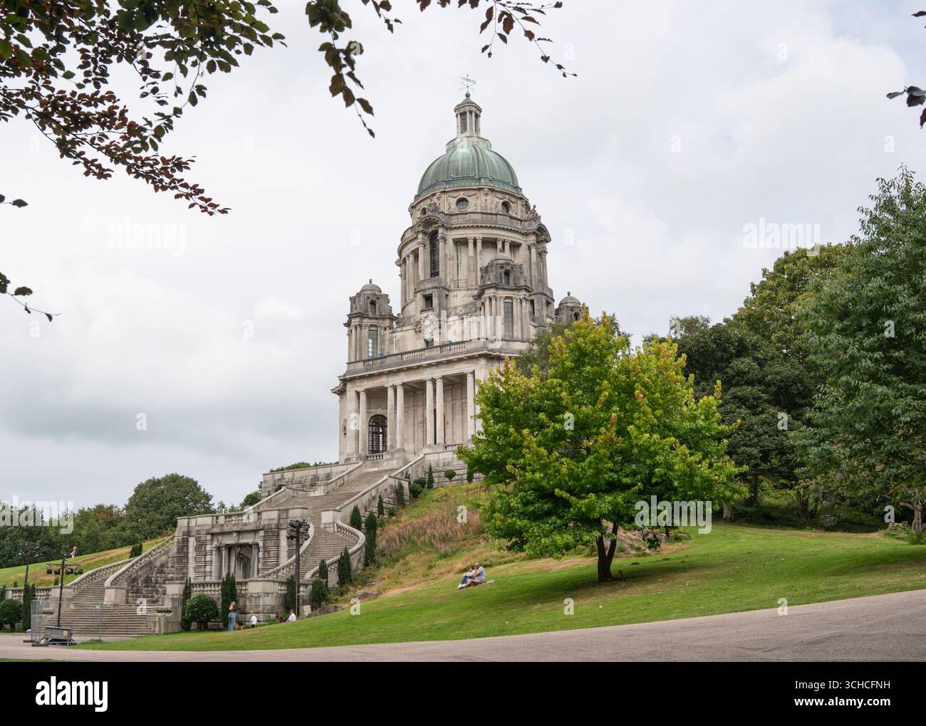 Ashton Memorial baroque tower with green copper dome in parkland ...