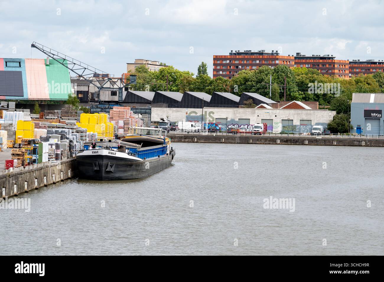 Bridge view over the banks of the canal with industrial activity ...