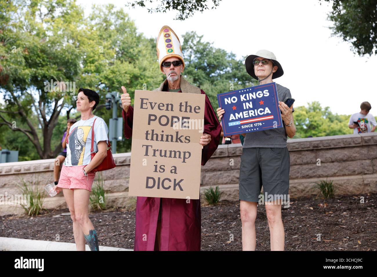 Hundreds gathered to protest President Donald Trump during the Memorial ...