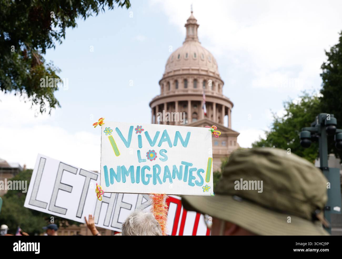 Hundreds gathered to protest President Donald Trump during the Memorial ...
