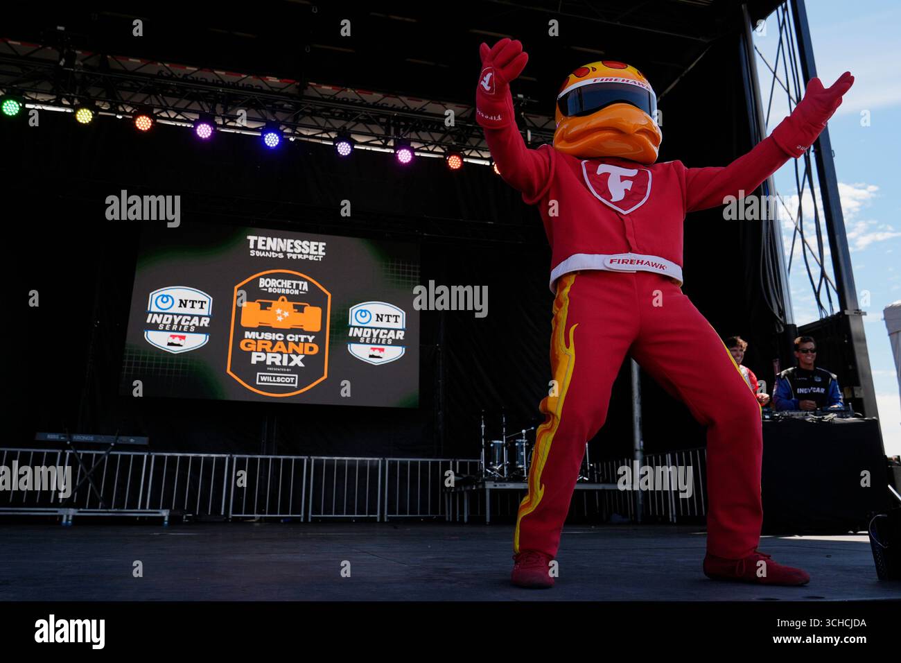Firehawk, the Firestone tire company mascot, dances on stage before an ...