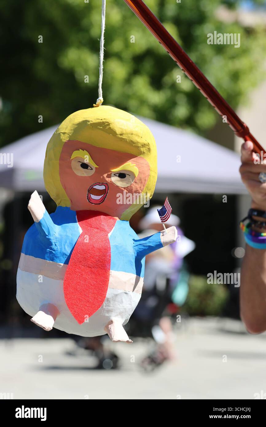 A miniature Trump pinata—now devoid of candy—is displayed during a ...