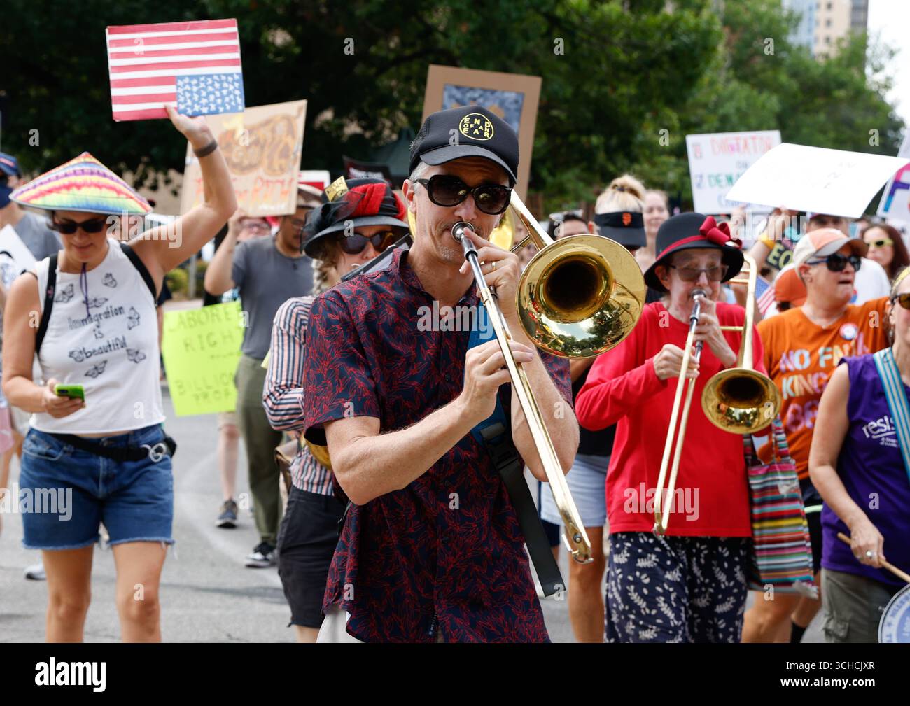 Hundreds gathered to protest President Donald Trump during the Memorial ...