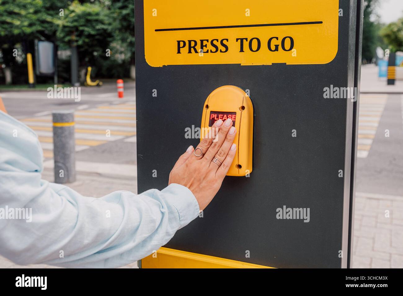 Woman activating pedestrian signal hi-res stock photography and images ...